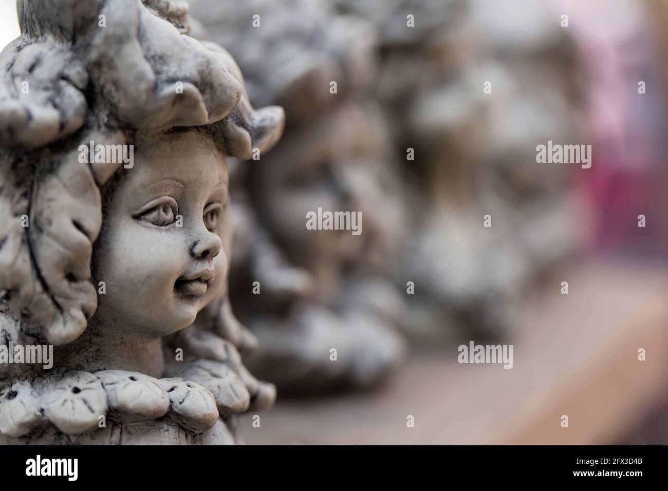Stone fairy bust made of stone Stock Photo - Alamy