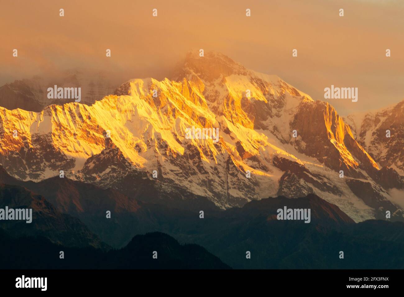 Sunset on Chaukhamba peaks, a mountain massif in the Gangotri Group of ...