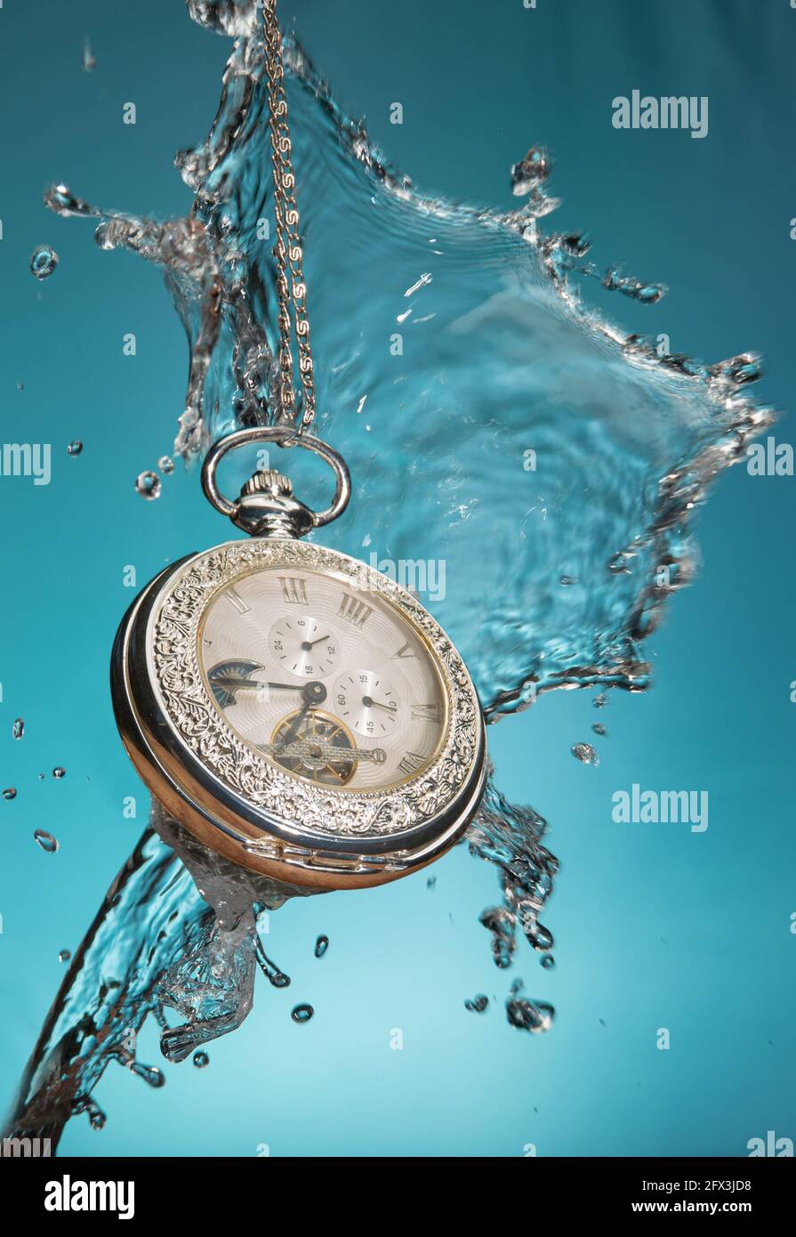 Watch vintage pocket and water in close up with blue background Stock ...