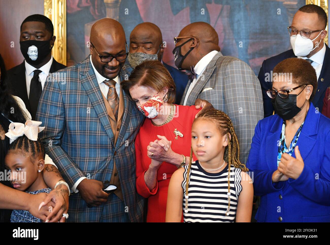Philonise Floyd, the brother of George Floyd, puts his arms around ...