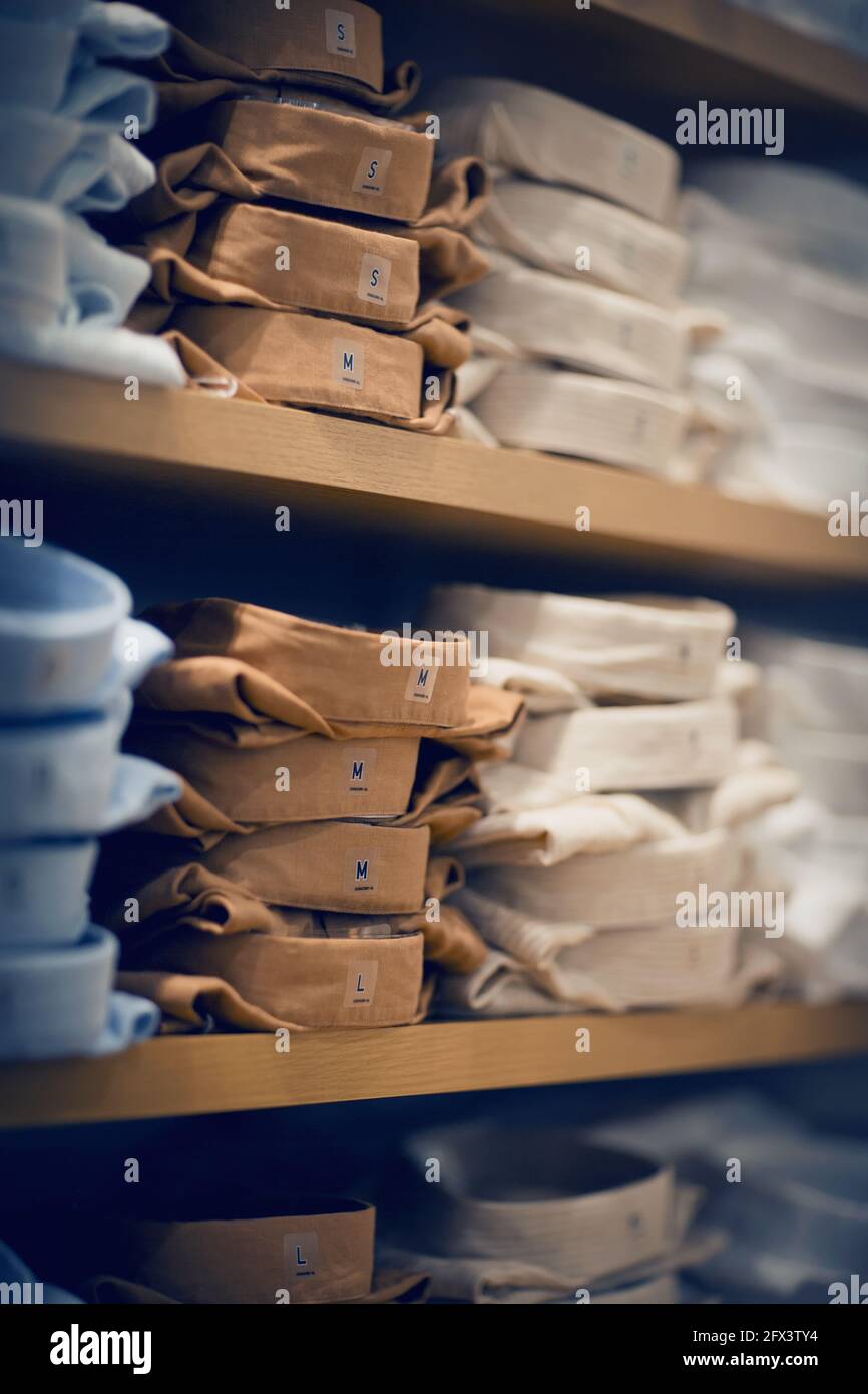 A stack of folded shirts. Stacks of clothes. Shopping in store ...