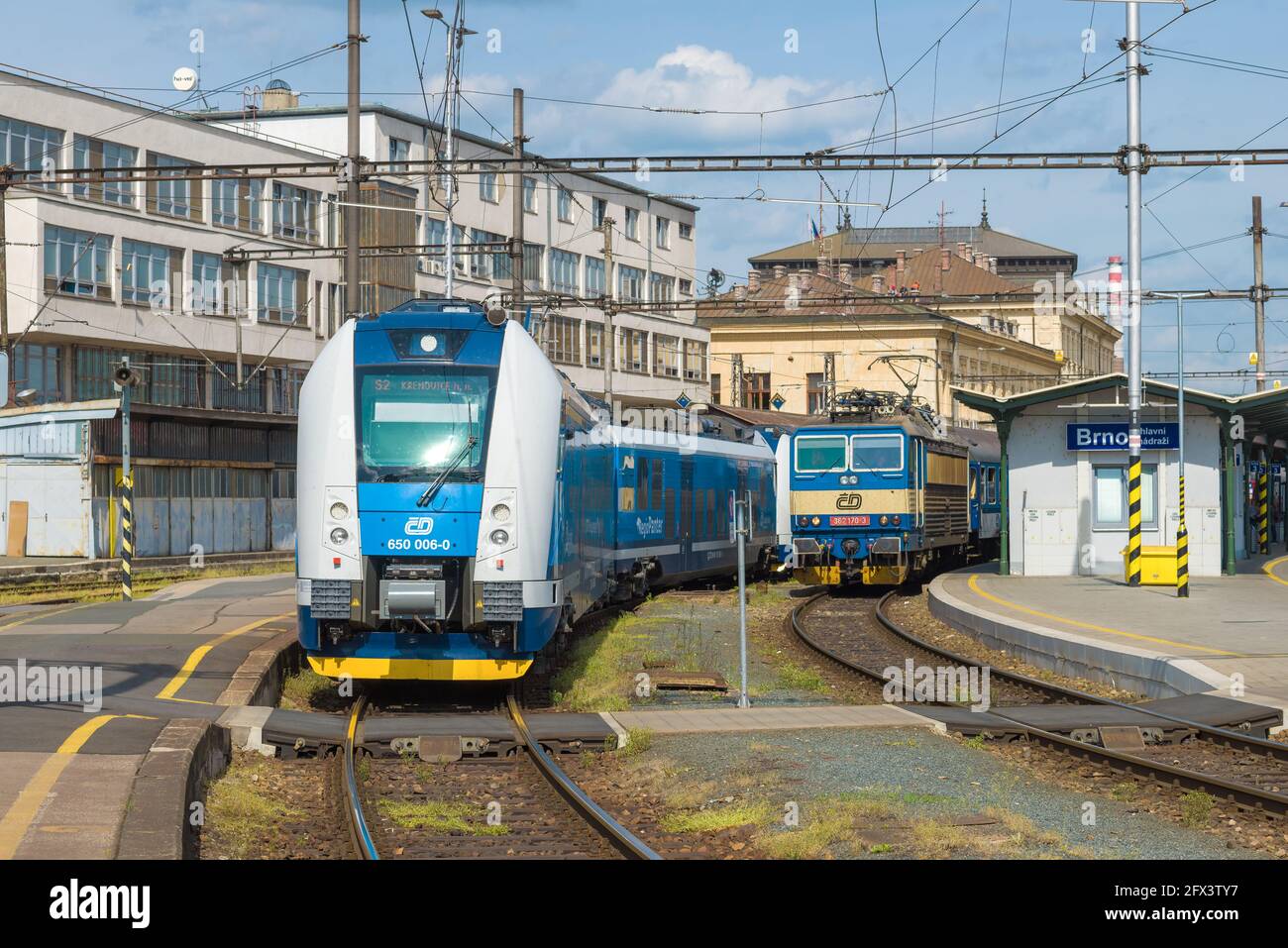 Two passenger trains at the platform on the main railway station in ...