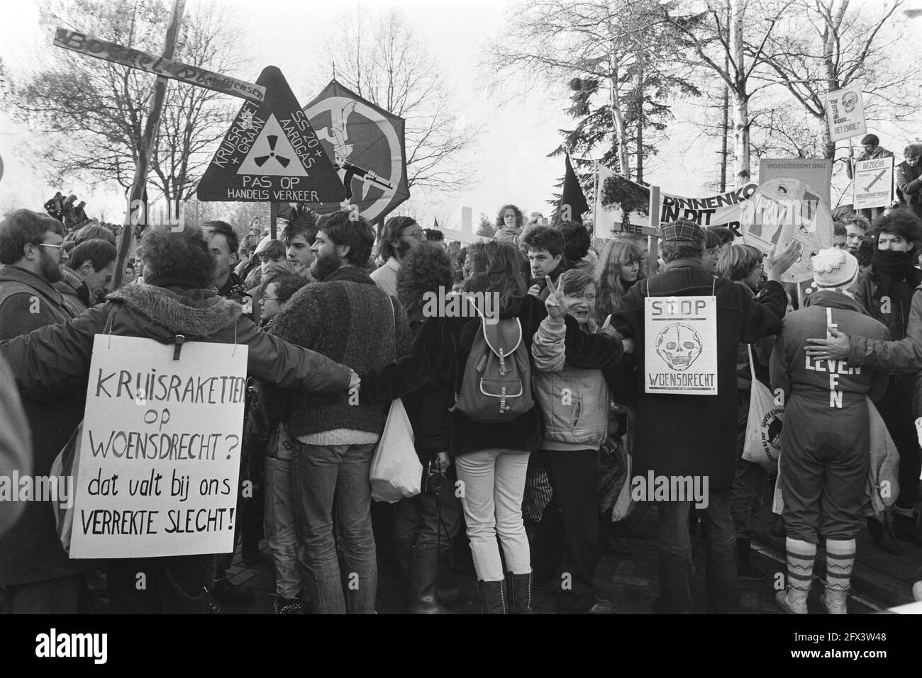 Demonstrating women hold up other demonstrators, December 11, 1983 ...