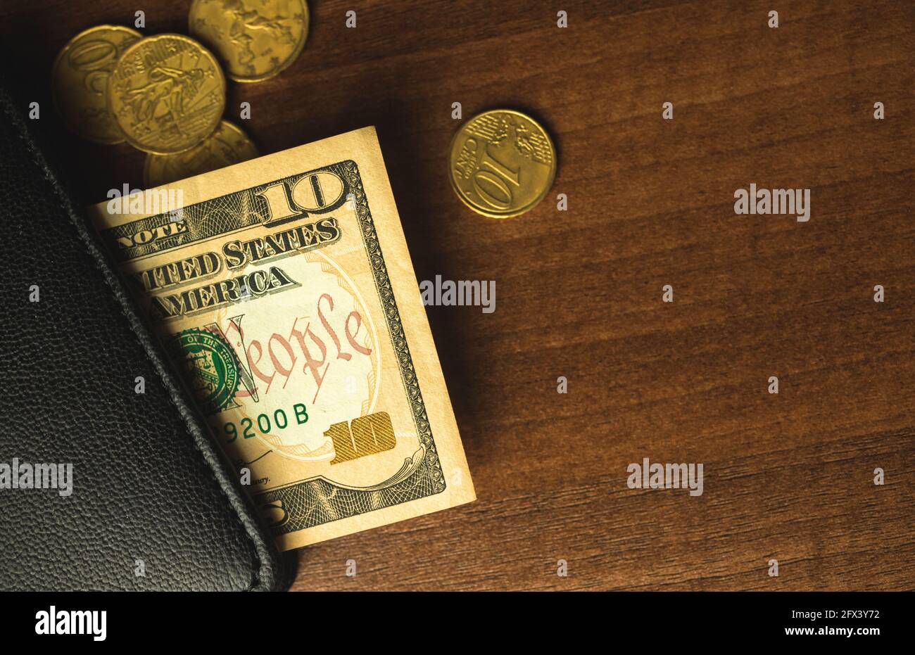 Last money savings concept, leather wallet with ten dollar bill and ...