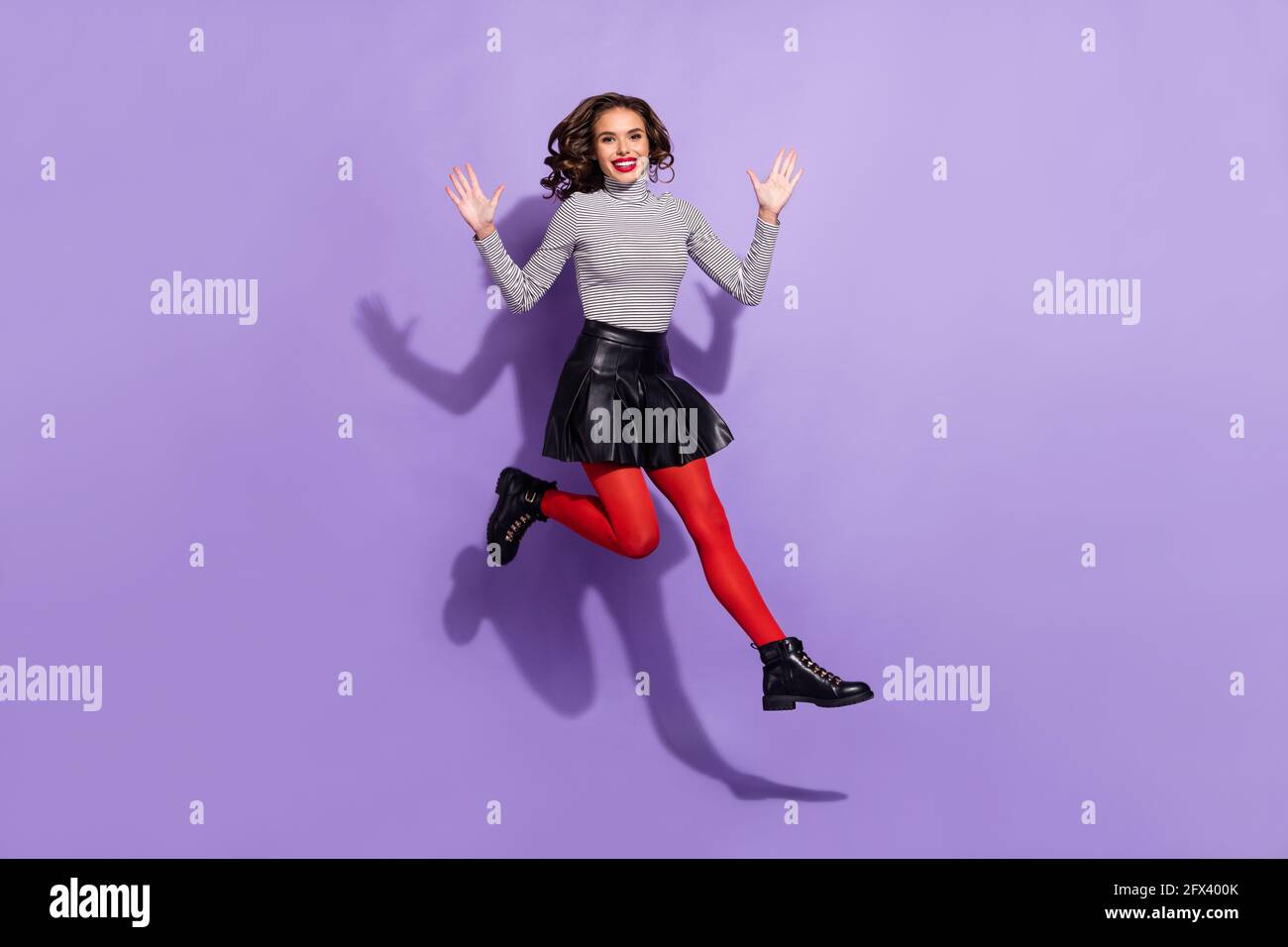 Full length photo of young cheerful girl happy positive smile jump up ...