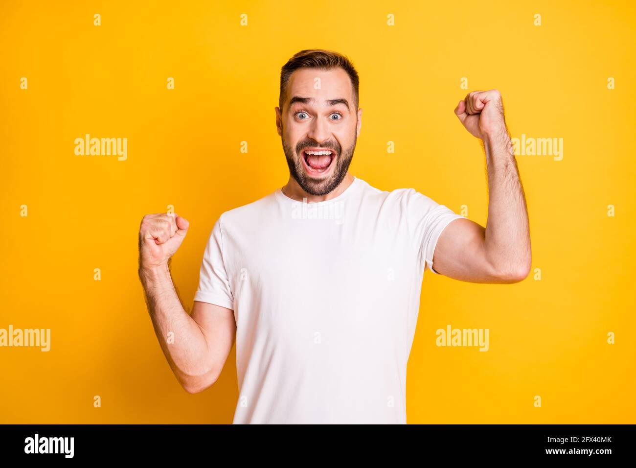 Portrait of attractive lucky cheerful bearded guy celebrating best luck ...