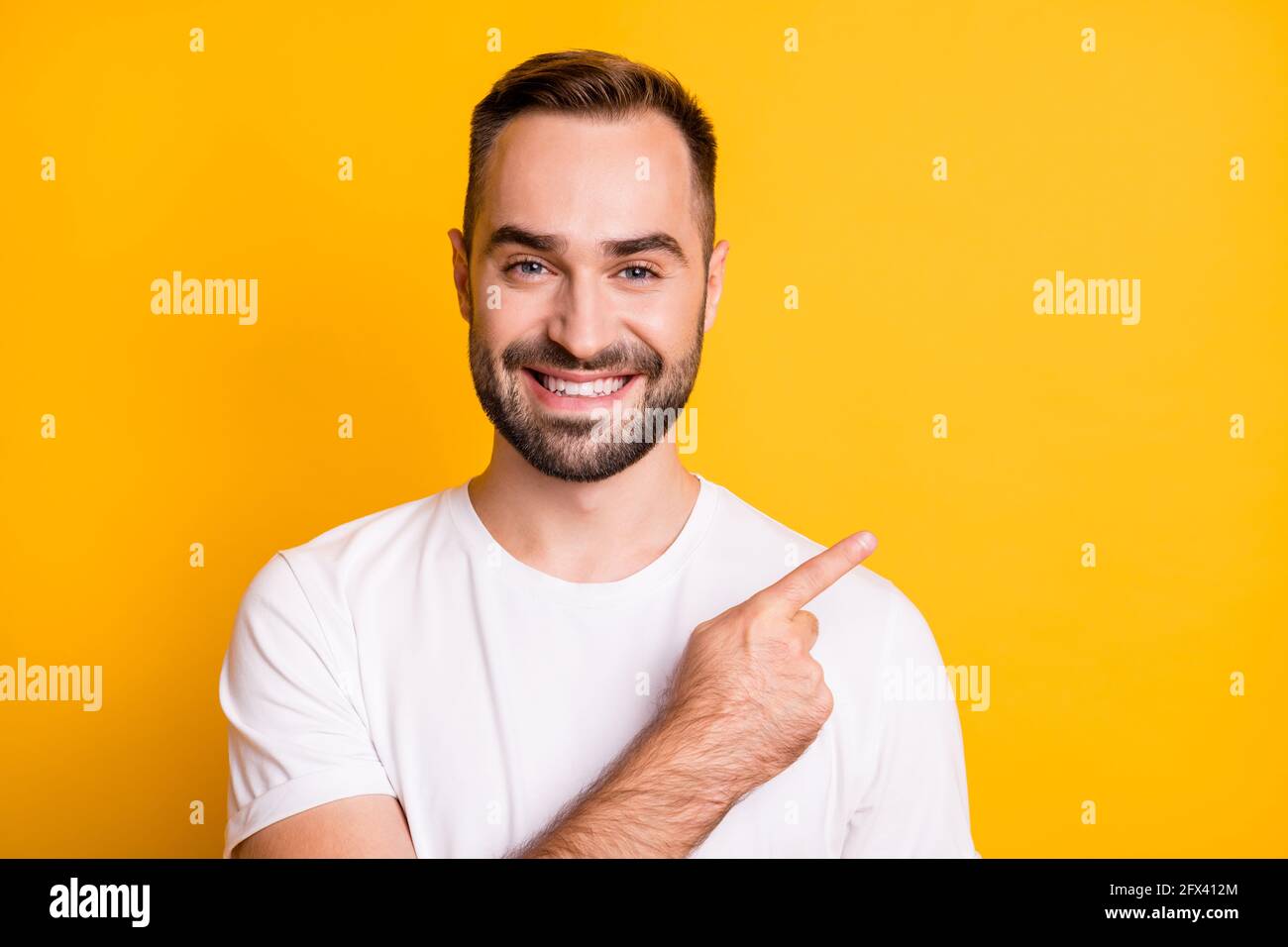 Profile Portrait Of Optimistic Guy Point Empty Space Wear White T Shirt