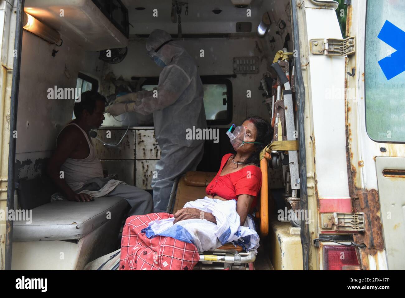 Guwahati, India. 25th May, 2021. A woman with breathing difficulty ...