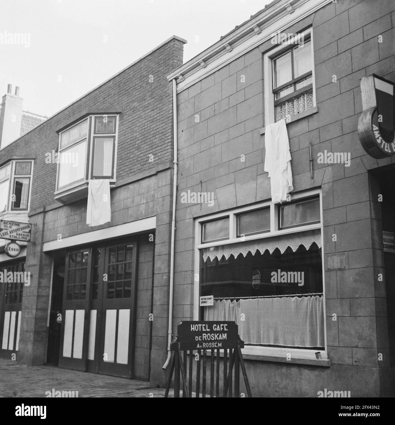 The sheets hang out of the windows to show the German occupiers that ...