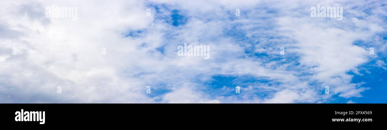 Clean blue sky with clouds panorama background Stock Photo - Alamy
