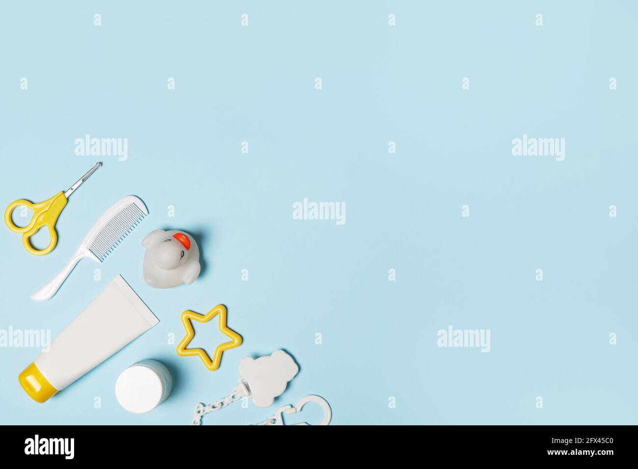 Baby accessories on blue background with copy space Stock Photo - Alamy