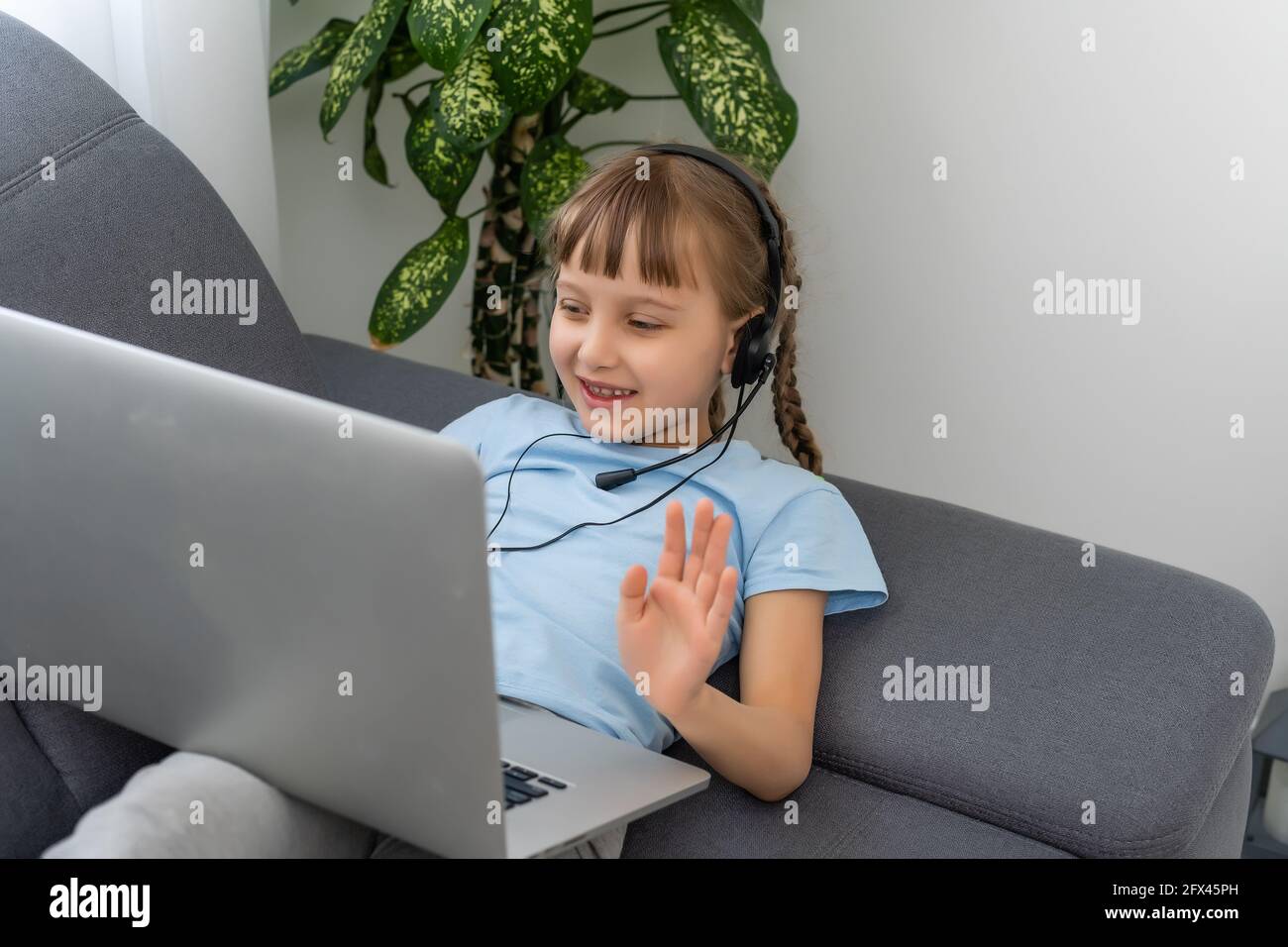 Homeschool little young girl student learning virtual internet online ...