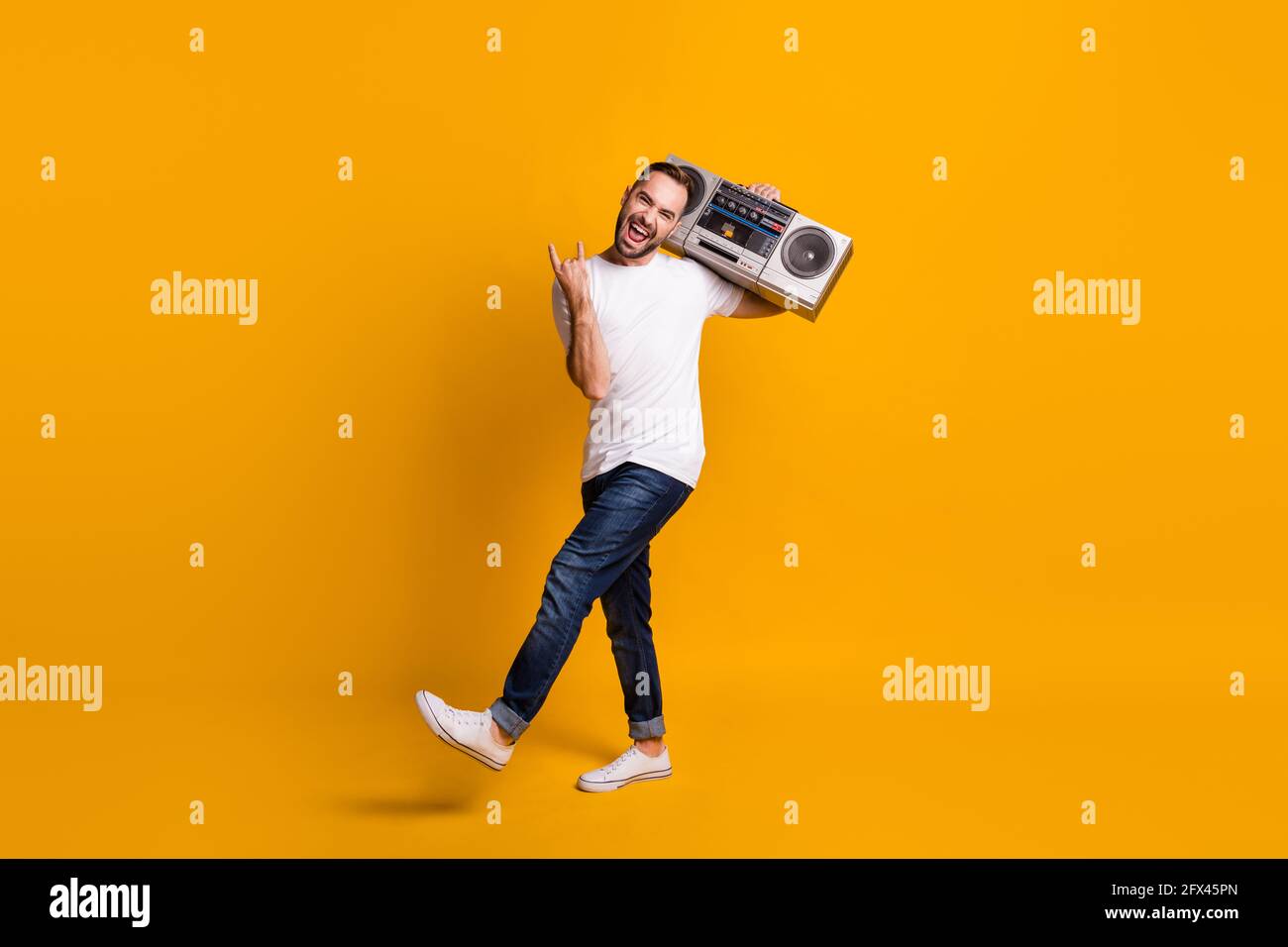 Full length body size view of cool cheerful guy dancing carrying player ...