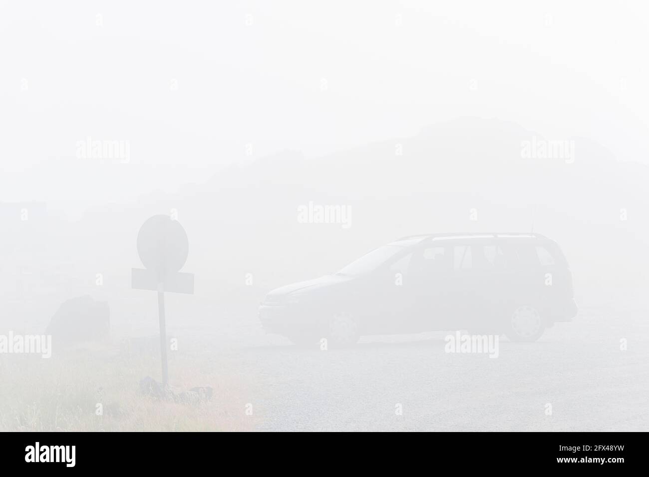 Car parked at parking place in fog Stock Photo - Alamy