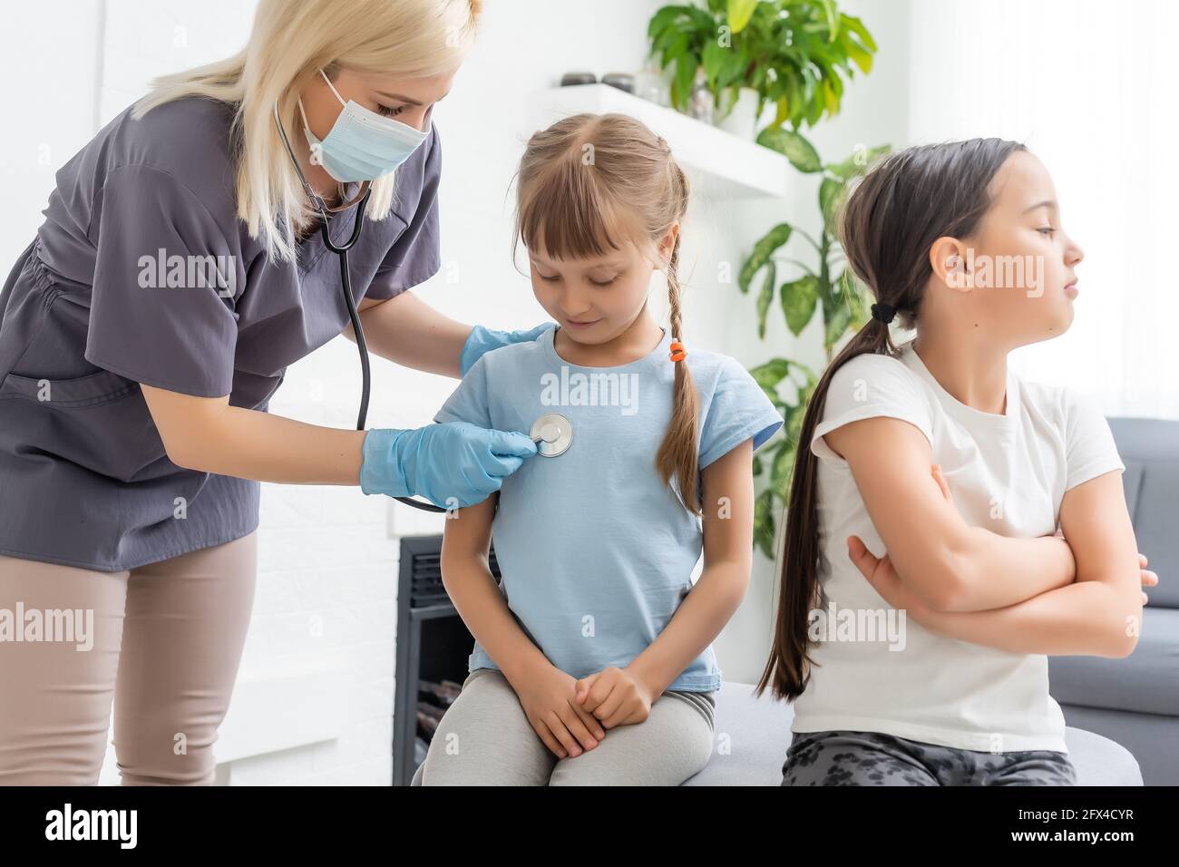 Little girl at the doctor's - pediatric checkup Stock Photo - Alamy