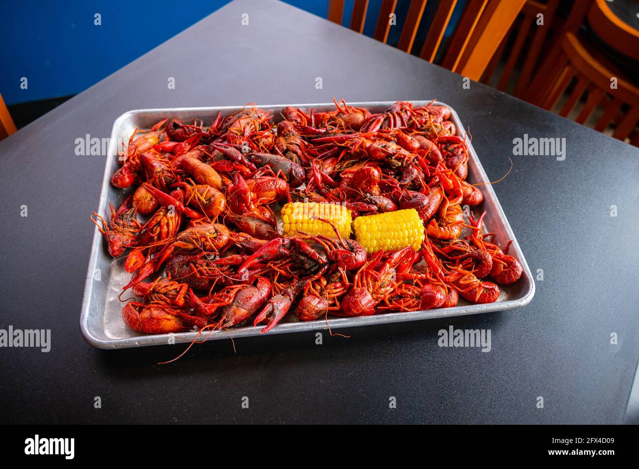 Boiled Crawfish and Yellow Corn on the cob Stock Photo - Alamy