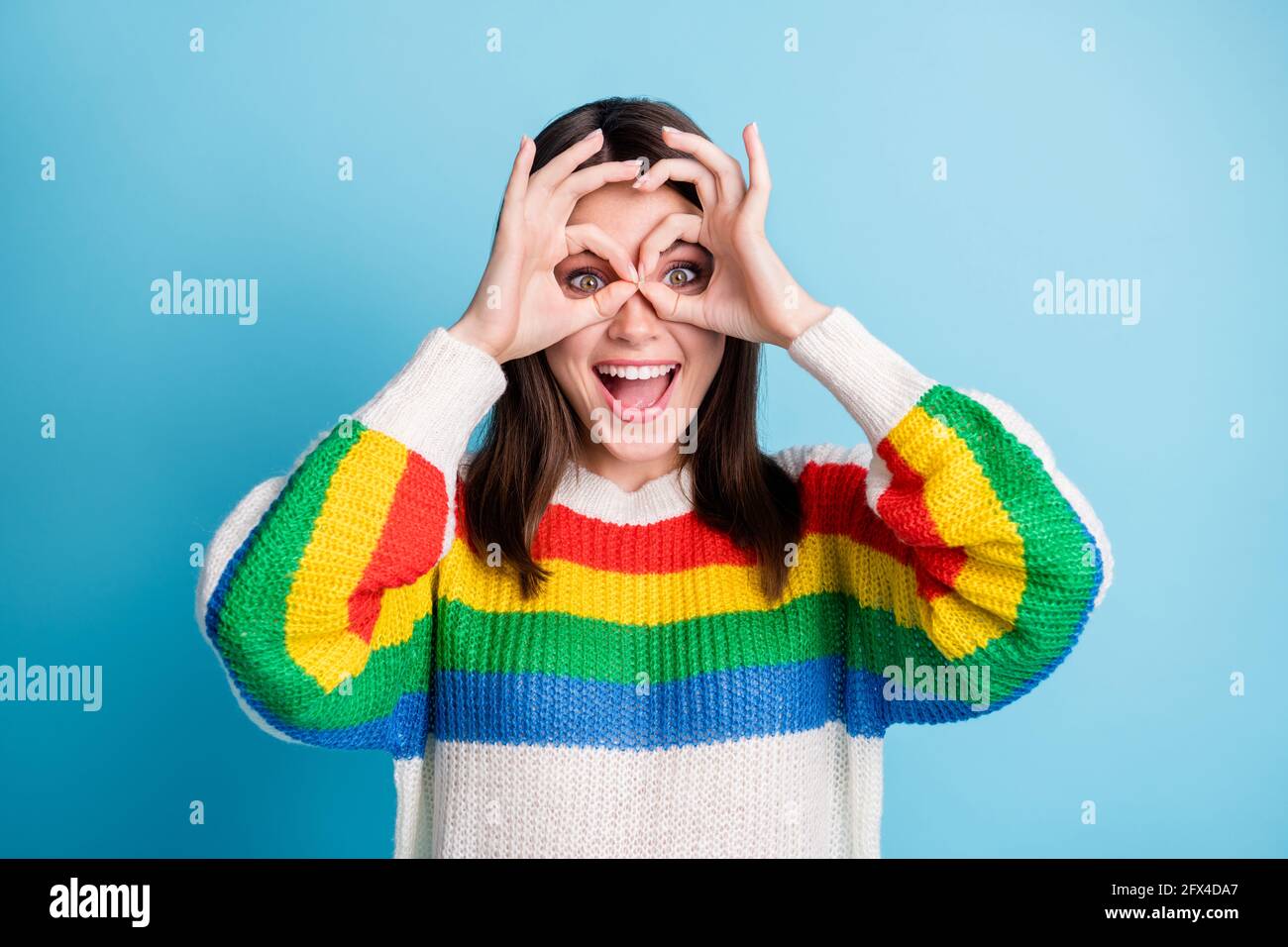 Photo of adorable playful young lady wear colorful pullover smiling ...