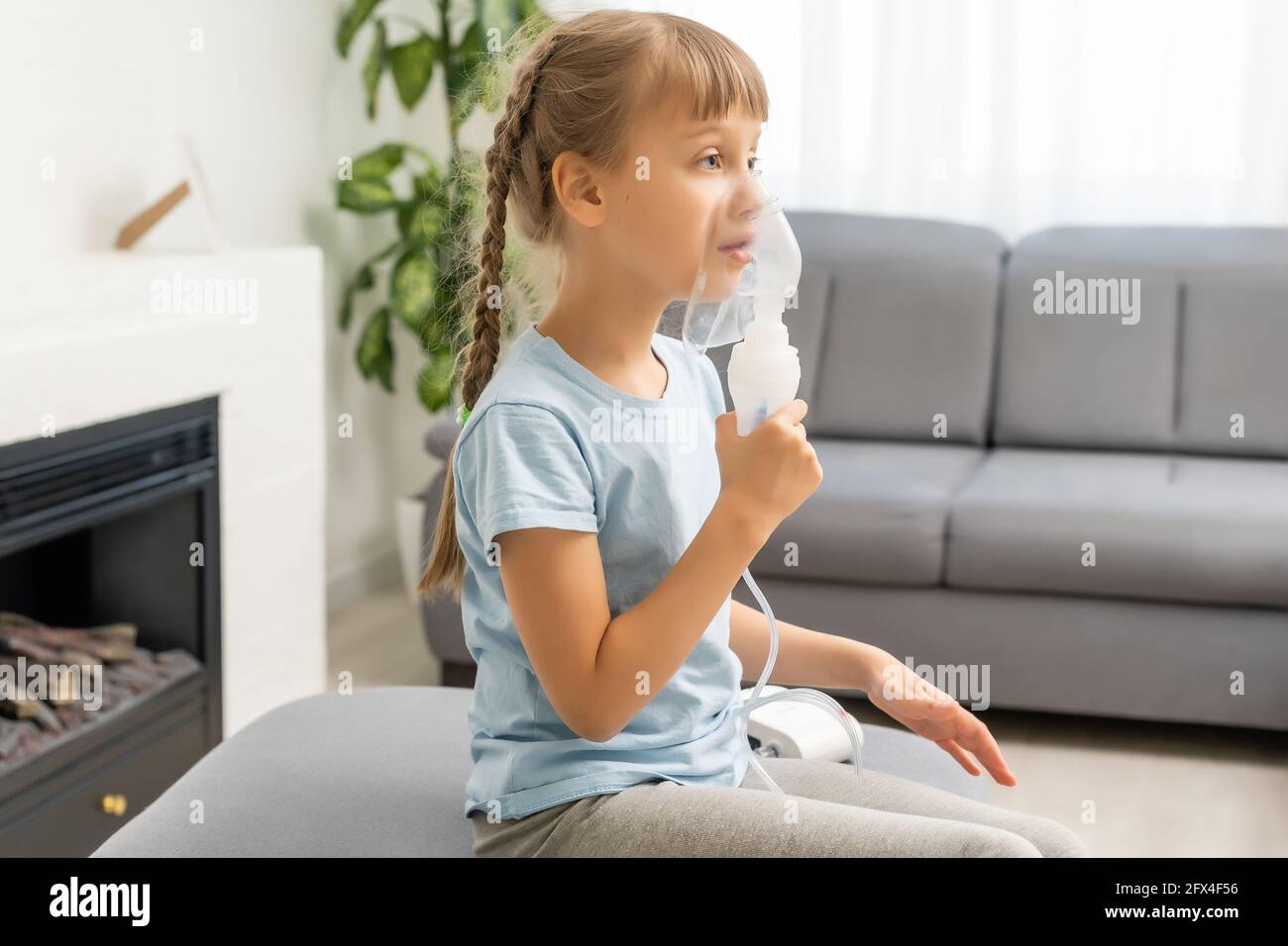 Little girl making inhalation with nebulizer at home. child asthma ...