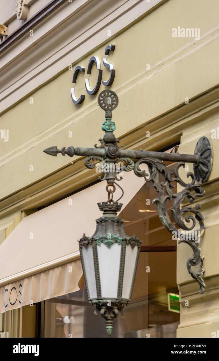 COS store sign behind the vintage street lamp hanging on a wall in St ...