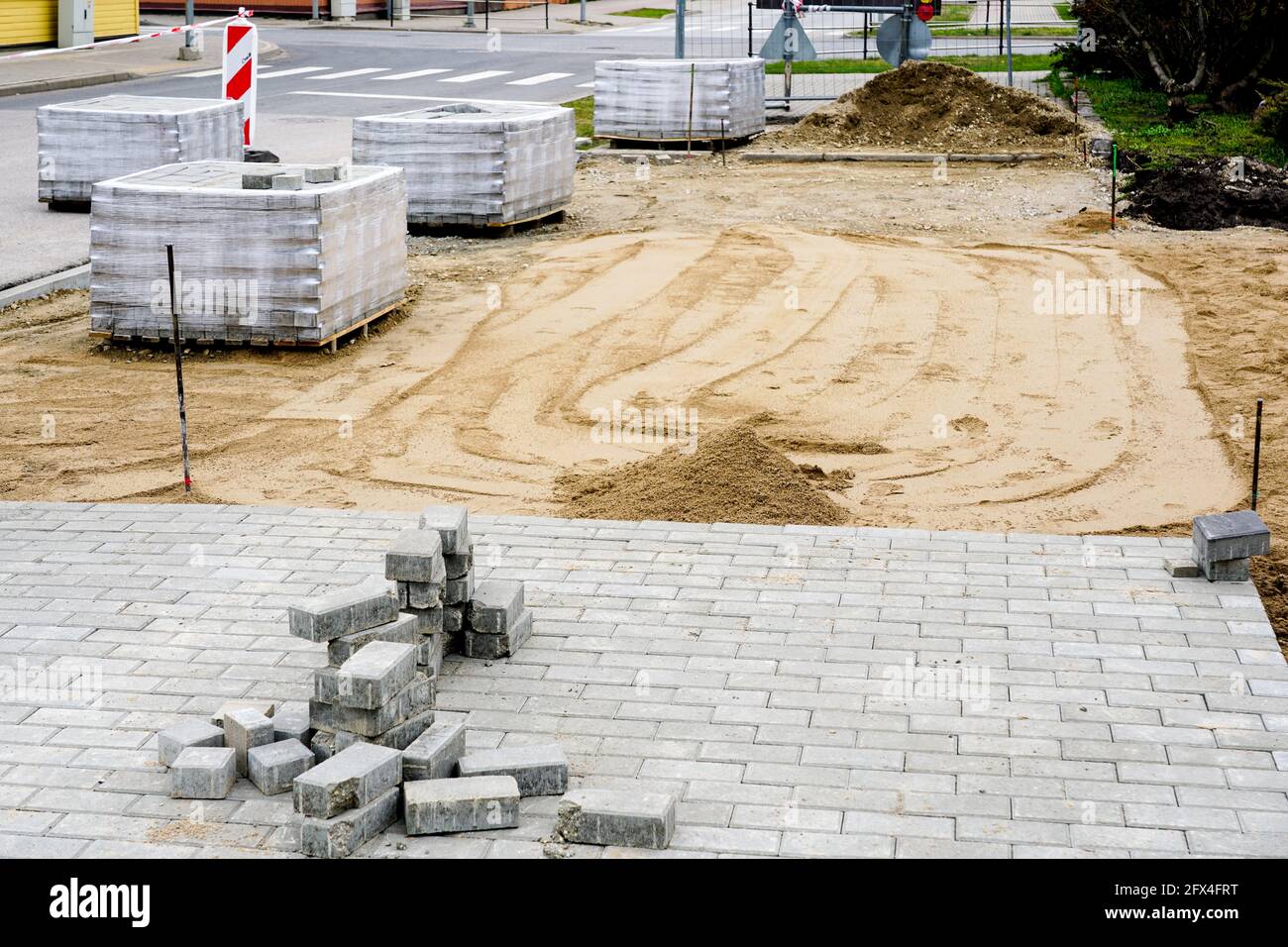 view of the pavement construction site, concrete slab pallets and the ...