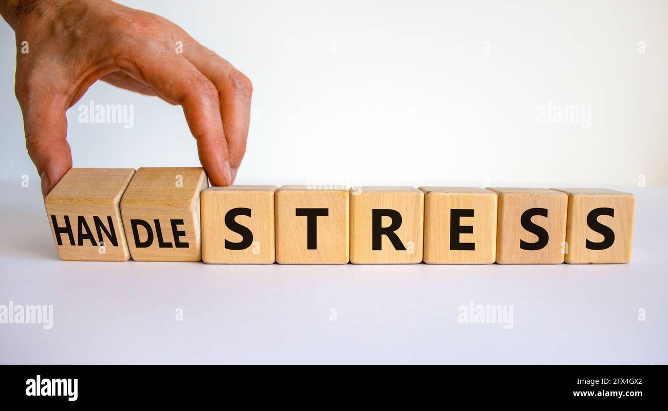 Handle stress symbol. Businessman turns cubes and changes words 'stress ...