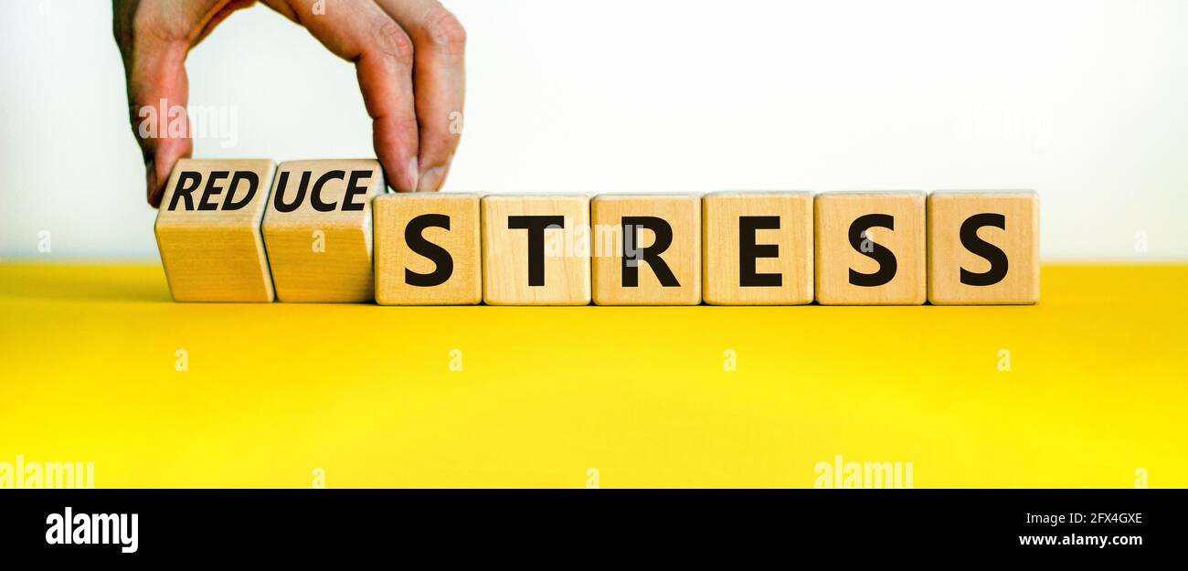 Reduce stress symbol. Businessman turns cubes and changes words 'stress ...