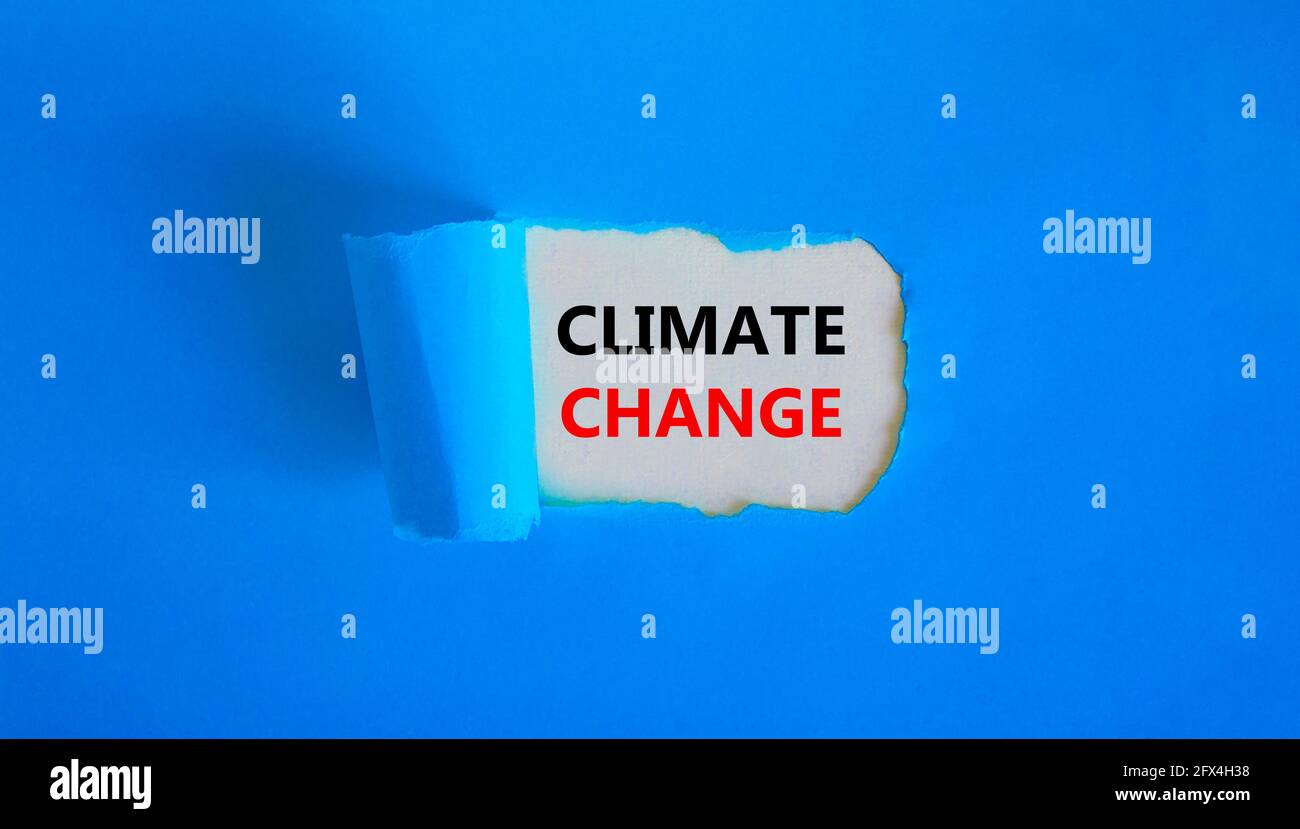 Climate change symbol. Words 'climate change' appearing behind torn ...