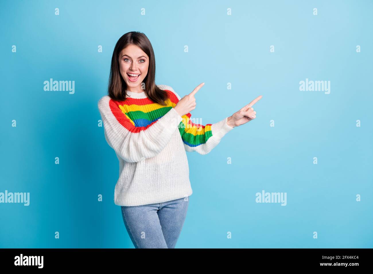 Photo of optimistic nice brunette lady point empty space wear sweater ...