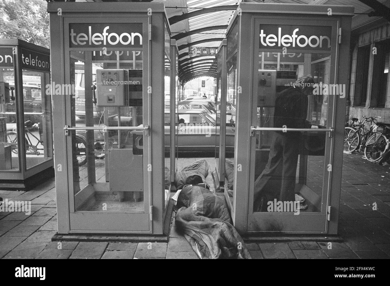 Sleepers at phone booths near Central Station in Amsterdam, July 4 ...