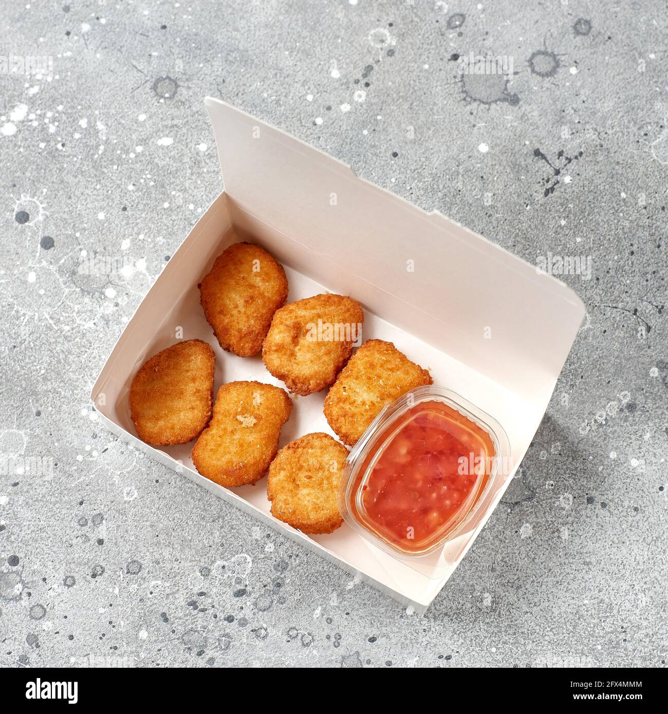 food delivery, takeaway food in paper containers with hot chicken ...