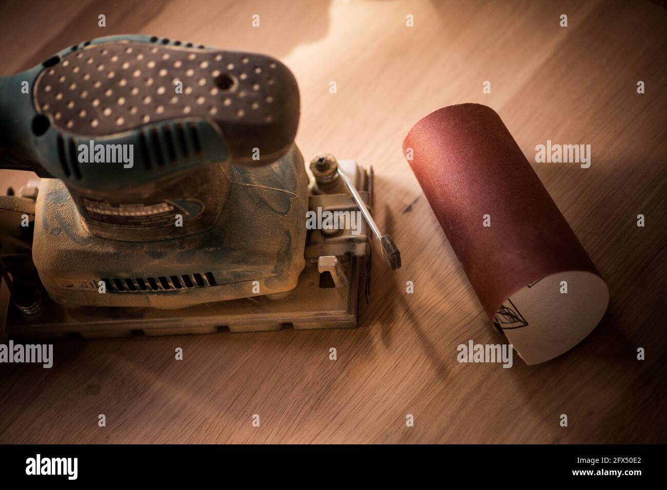 Electric sand machine and sand paper Stock Photo - Alamy