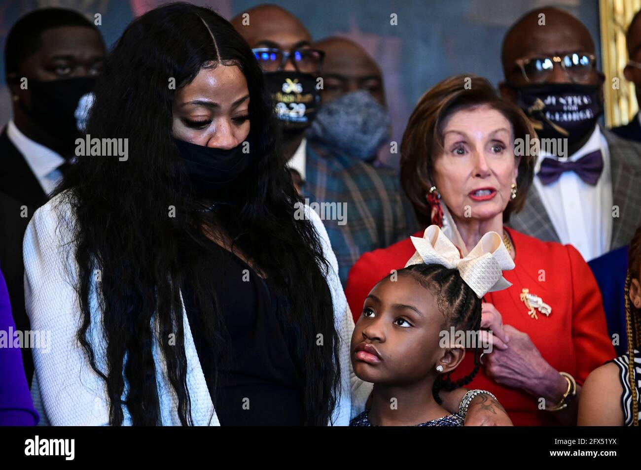 Gianna Floyd, George Floyd's daughter, looks up at her mother, Roxie ...