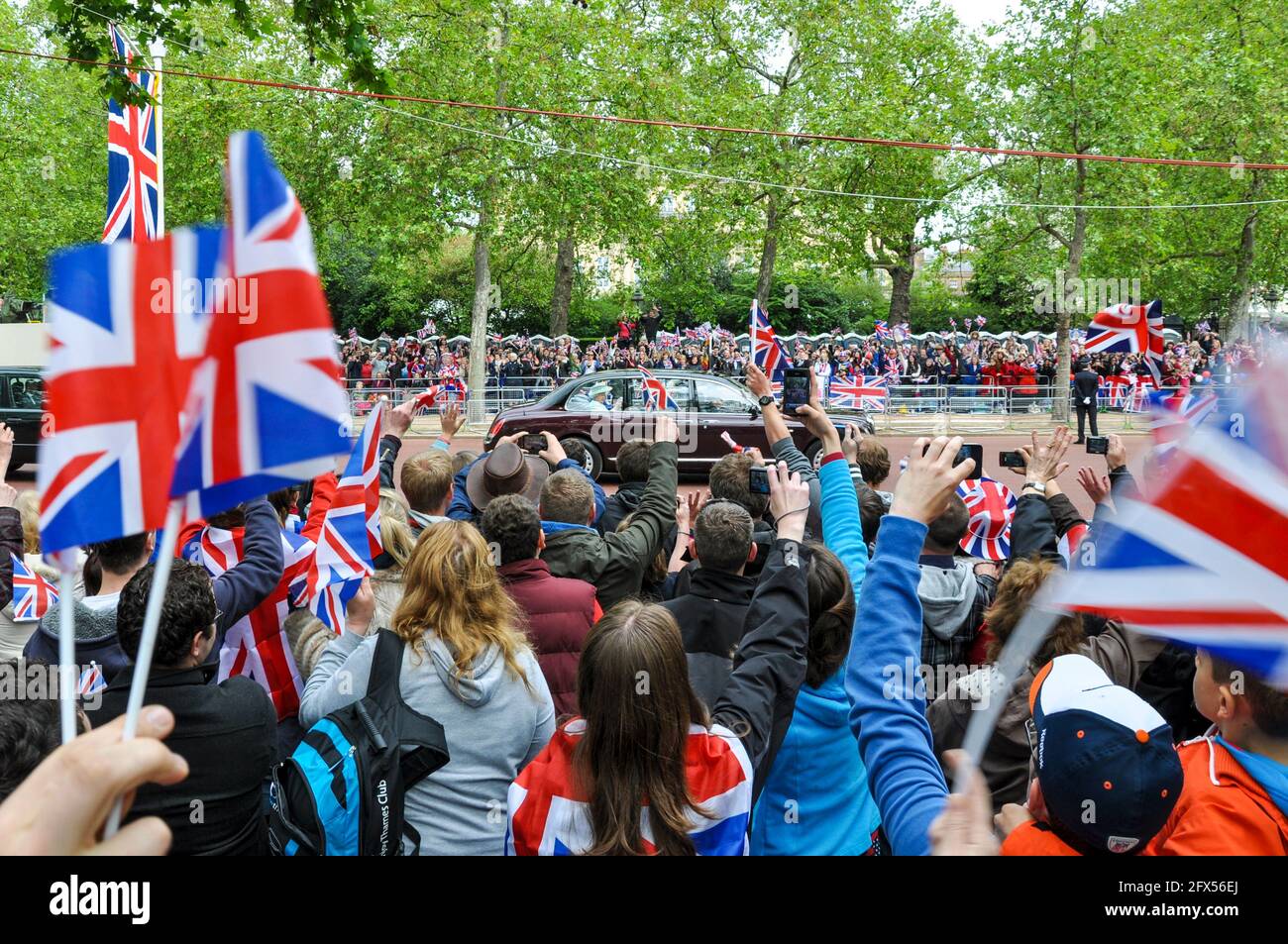 HM The Queen Elizabeth II passing crowds of members of the public ...