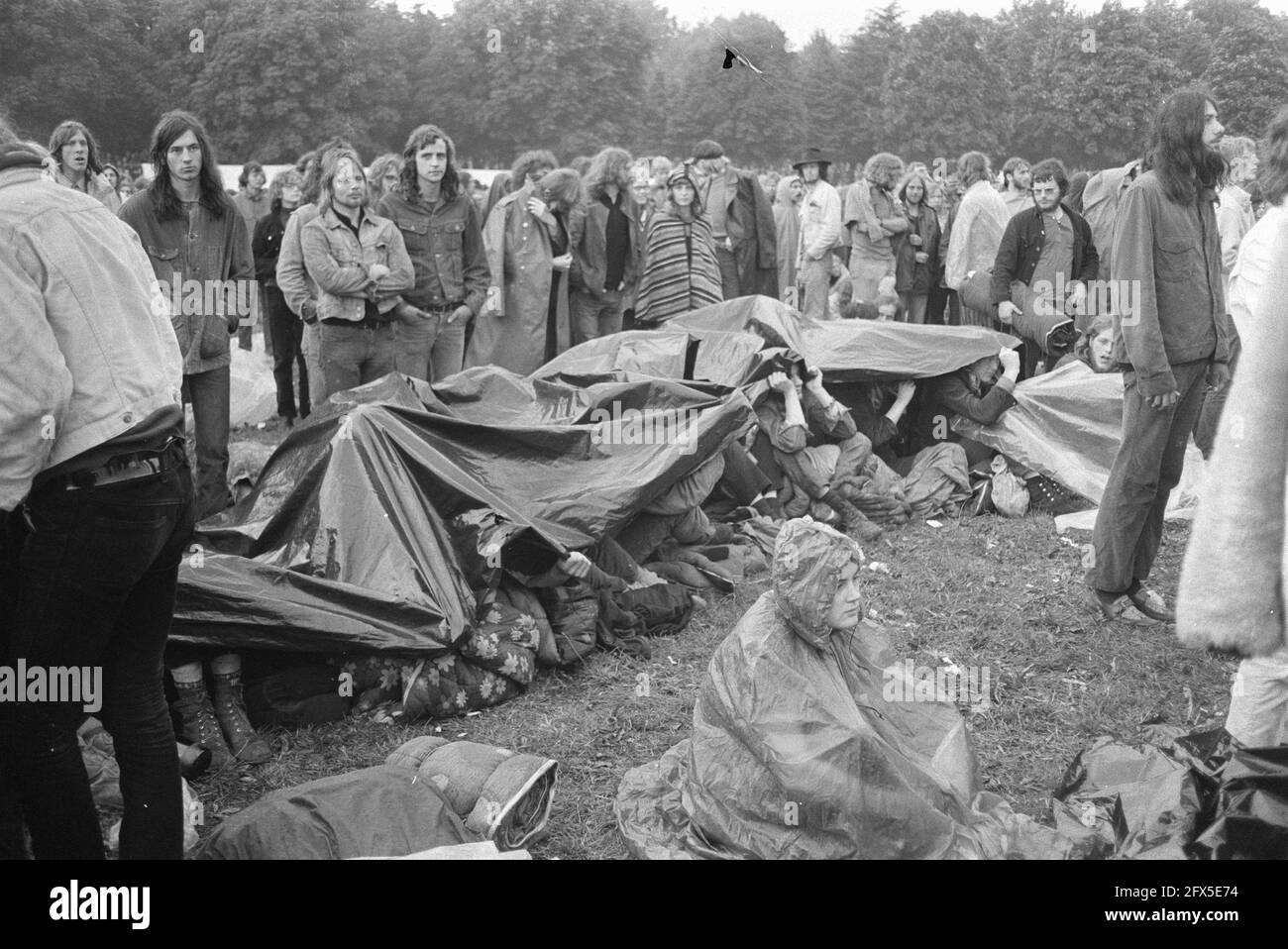 Audience under rain gear hi-res stock photography and images - Alamy