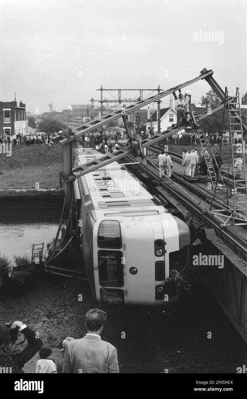 Tilted train with the railroad bridge on the right, September 15, 1980 ...