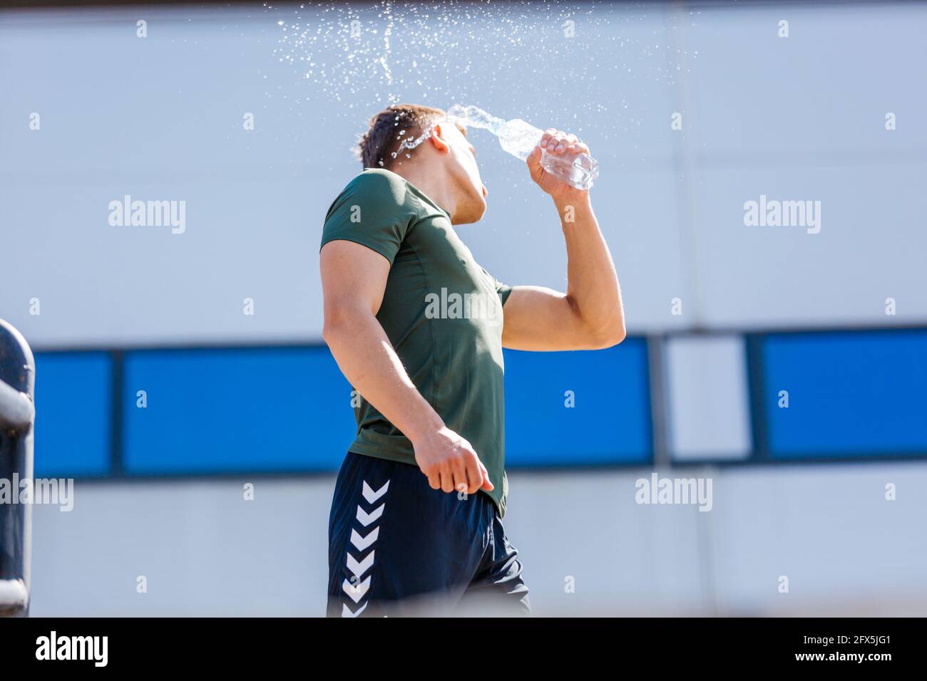 Muscular men drinking water from hi-res stock photography and images ...