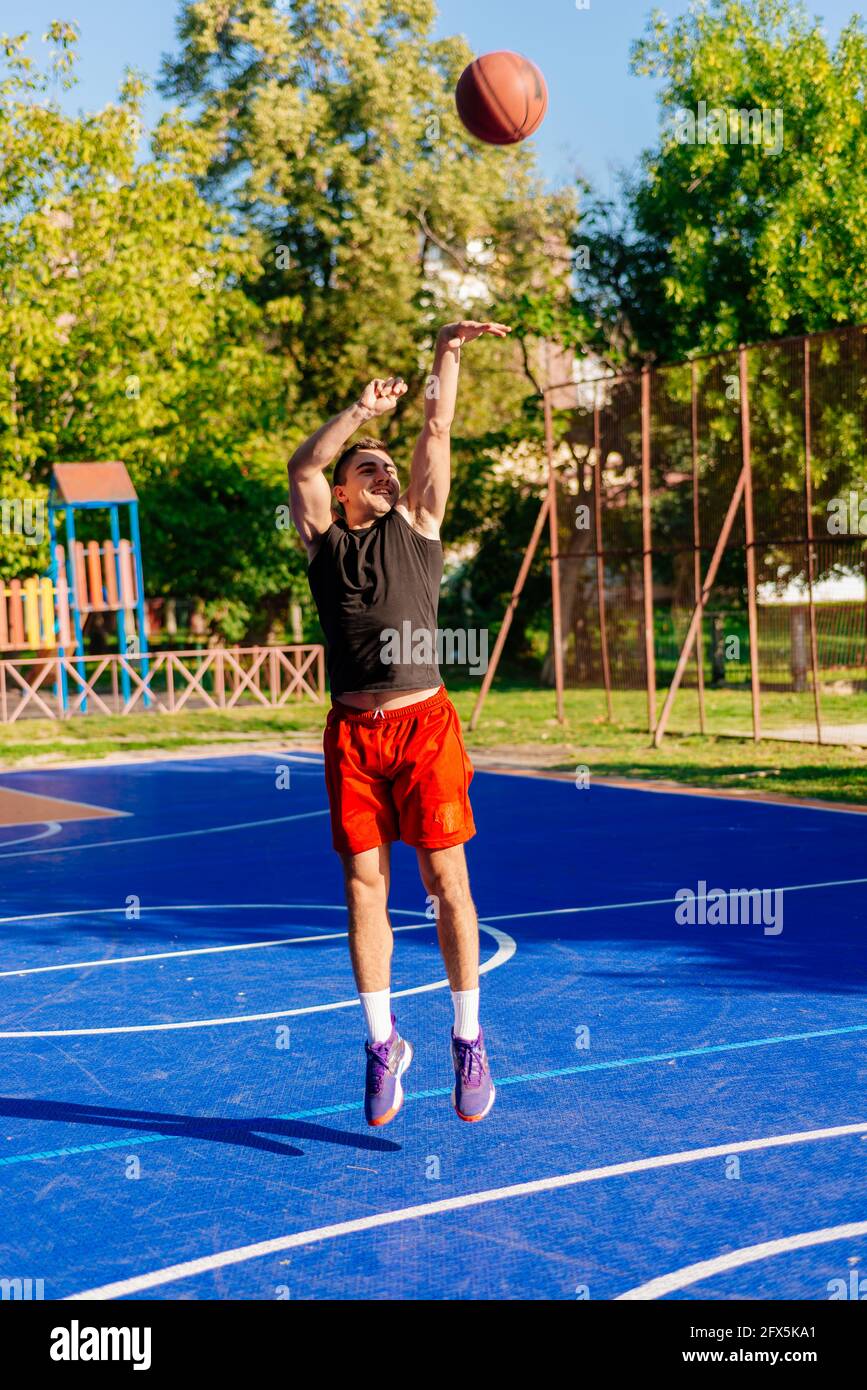Basketball player jump shooting and playing basketball Stock Photo - Alamy