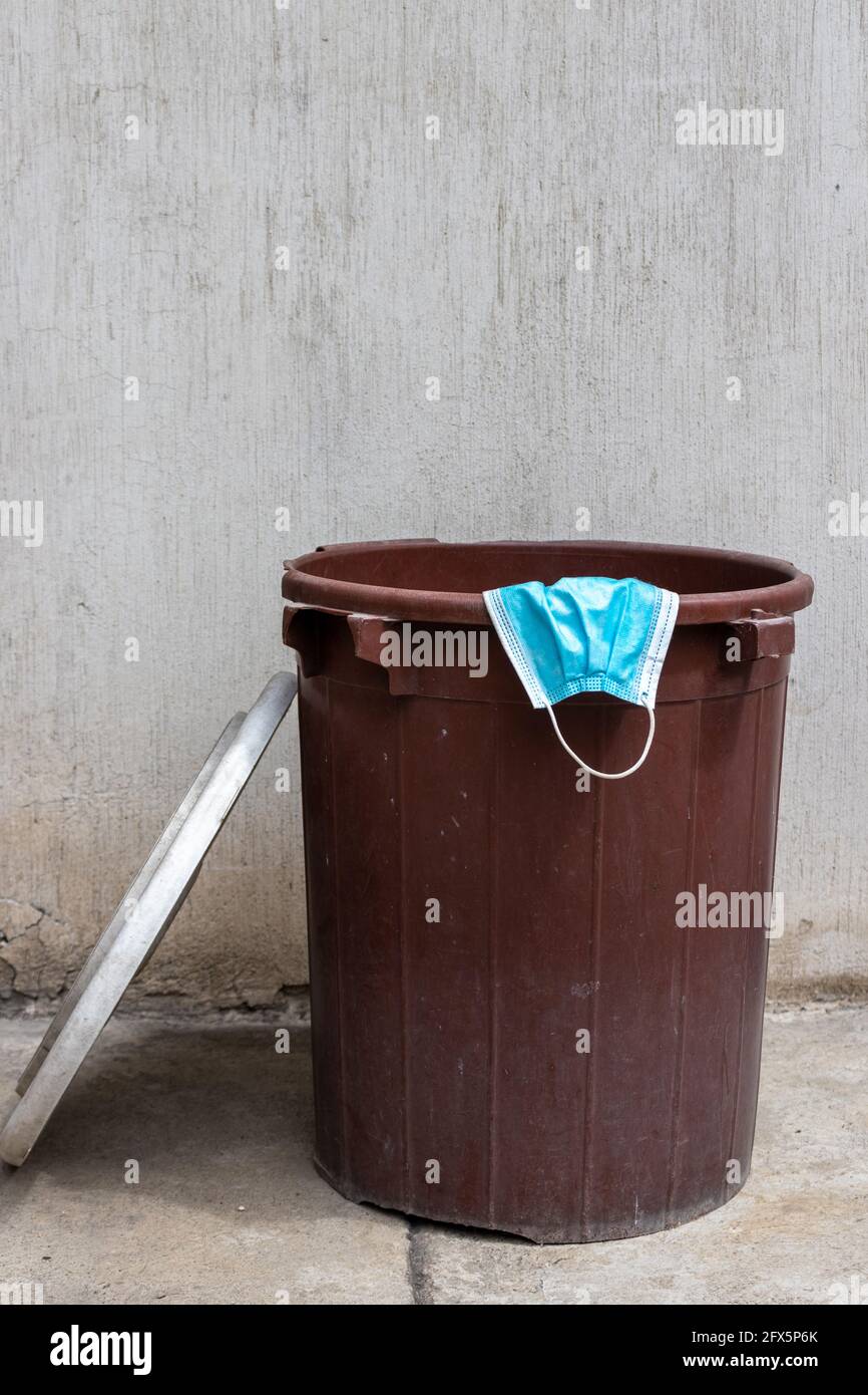 face mask inside garbage can , covid-19 pandemic is over concept Stock ...
