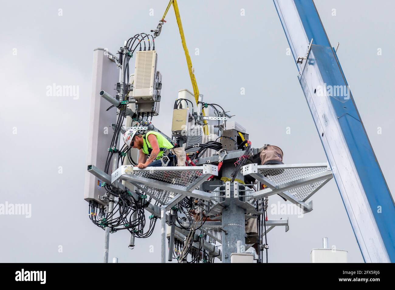 Detroit, Michigan - Workers upgrade an AT&T cell tower to the faster 5G ...