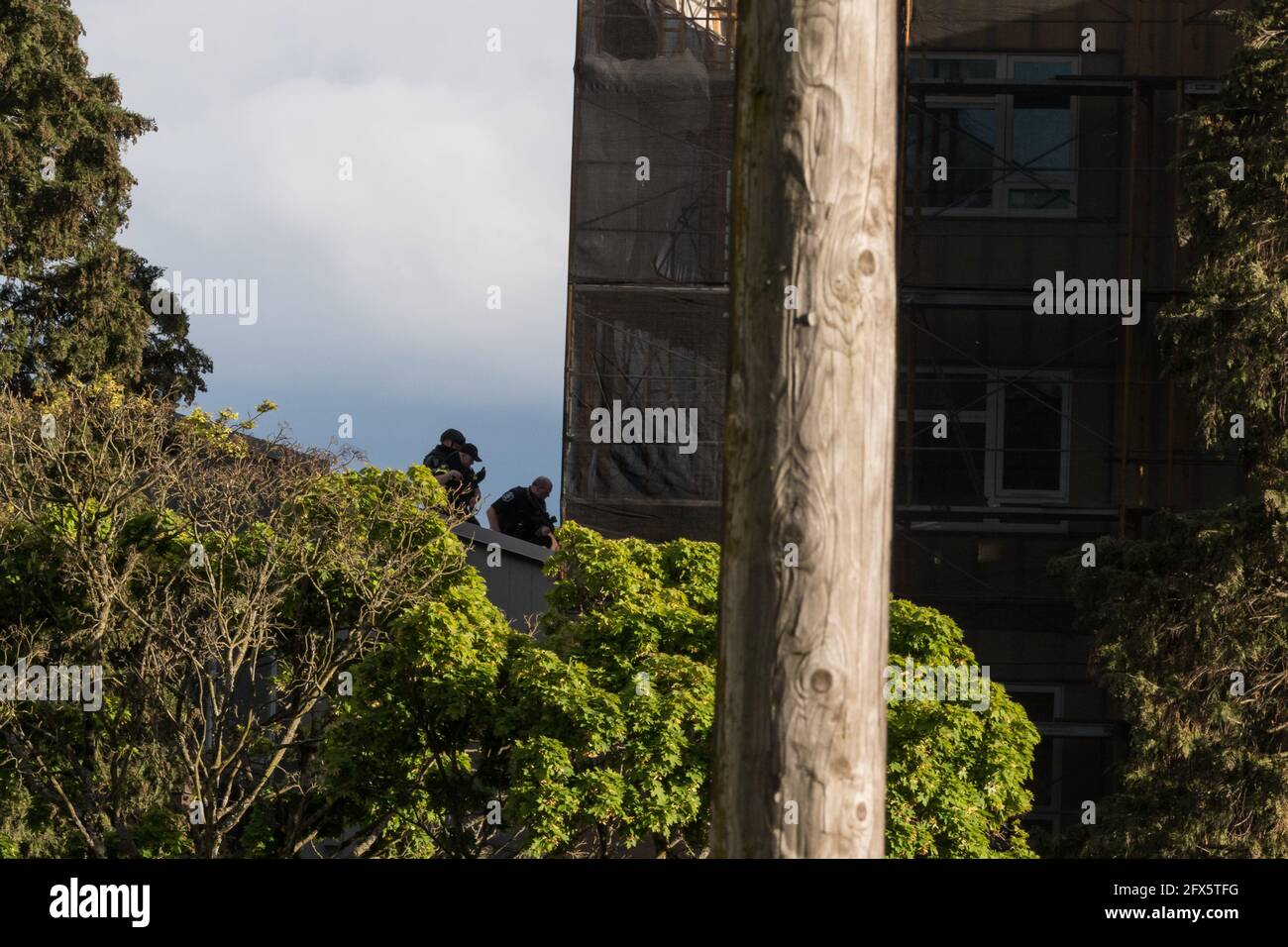 Seattle, USA. 7th May, 2021. Late in the day police during a barricaded ...