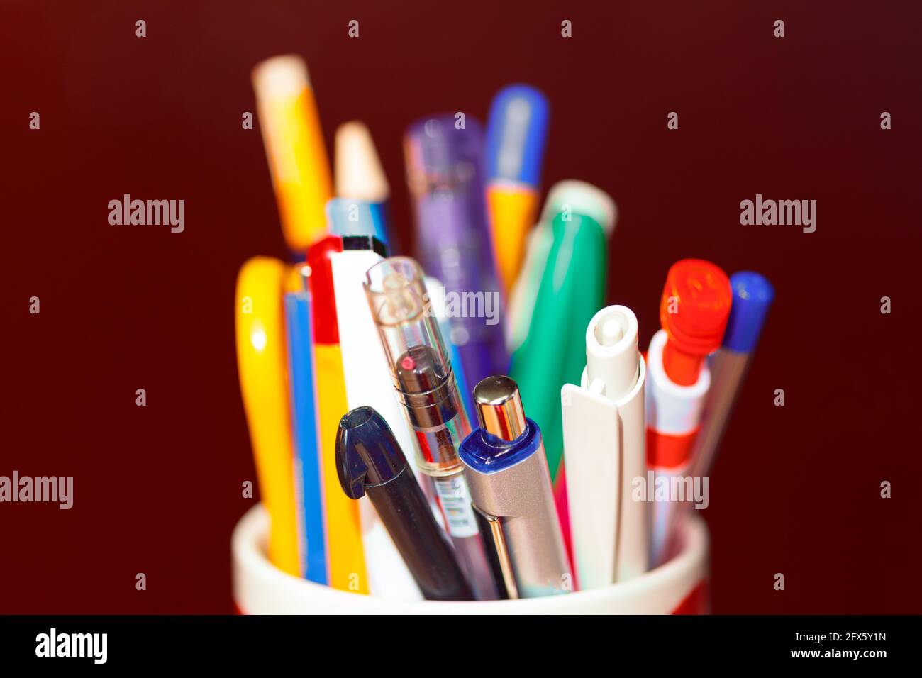 Pens for school in a pile . Stack of colorful pens Stock Photo - Alamy