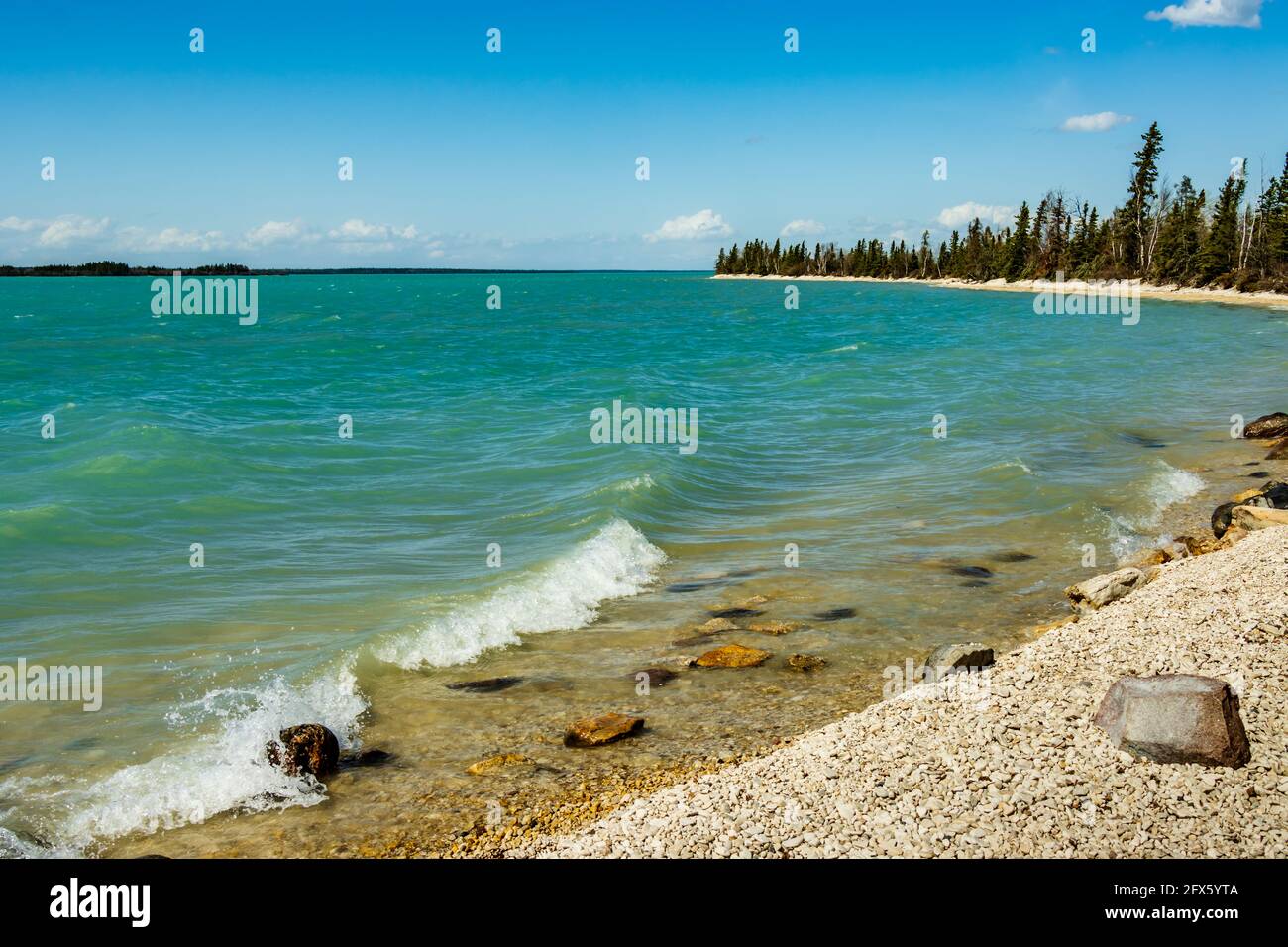 Imagine of the turquoise waters and rock beach of Little Limestone Lake ...