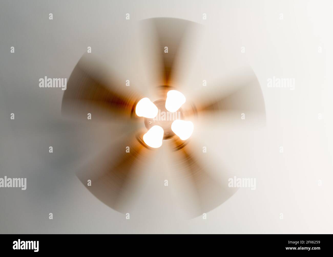 Residential ceiling fan in motion on a white ceiling Stock Photo - Alamy