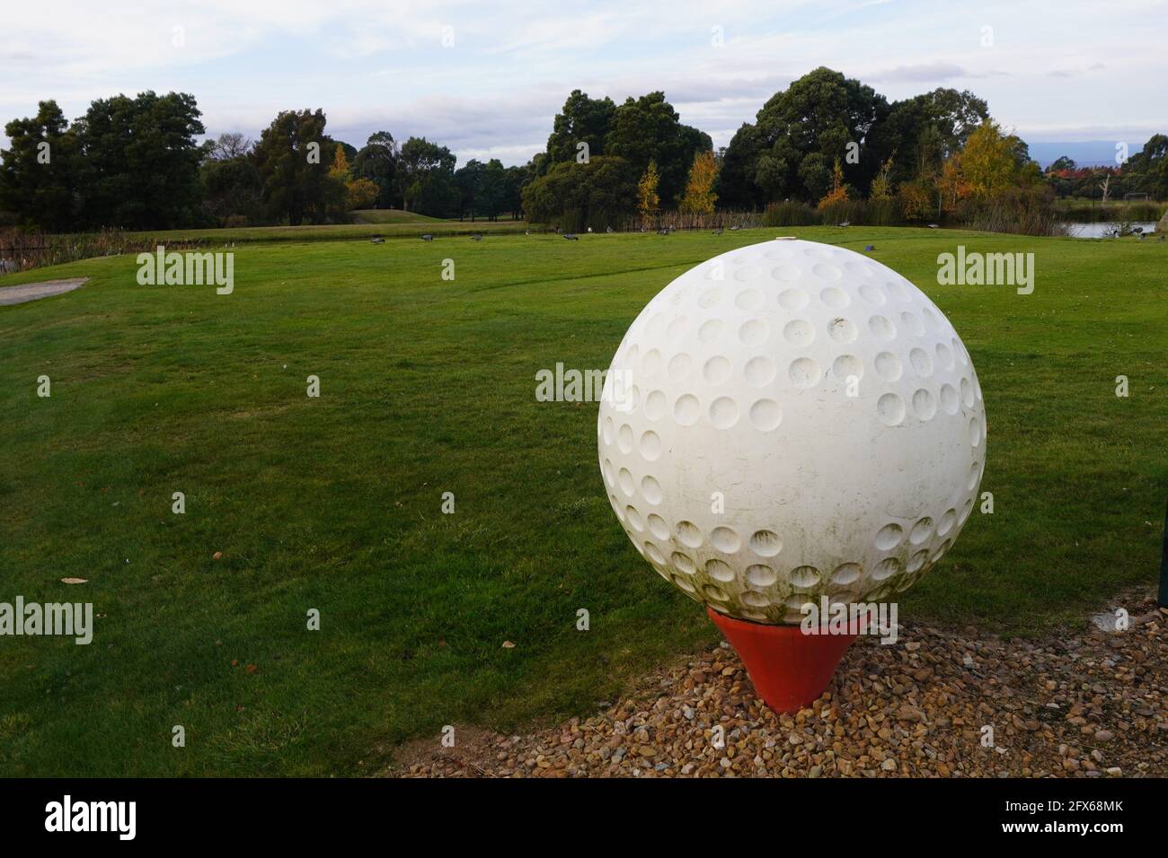Giant Generic Golf Ball in an idyllic Autumn Landscape Stock Photo - Alamy