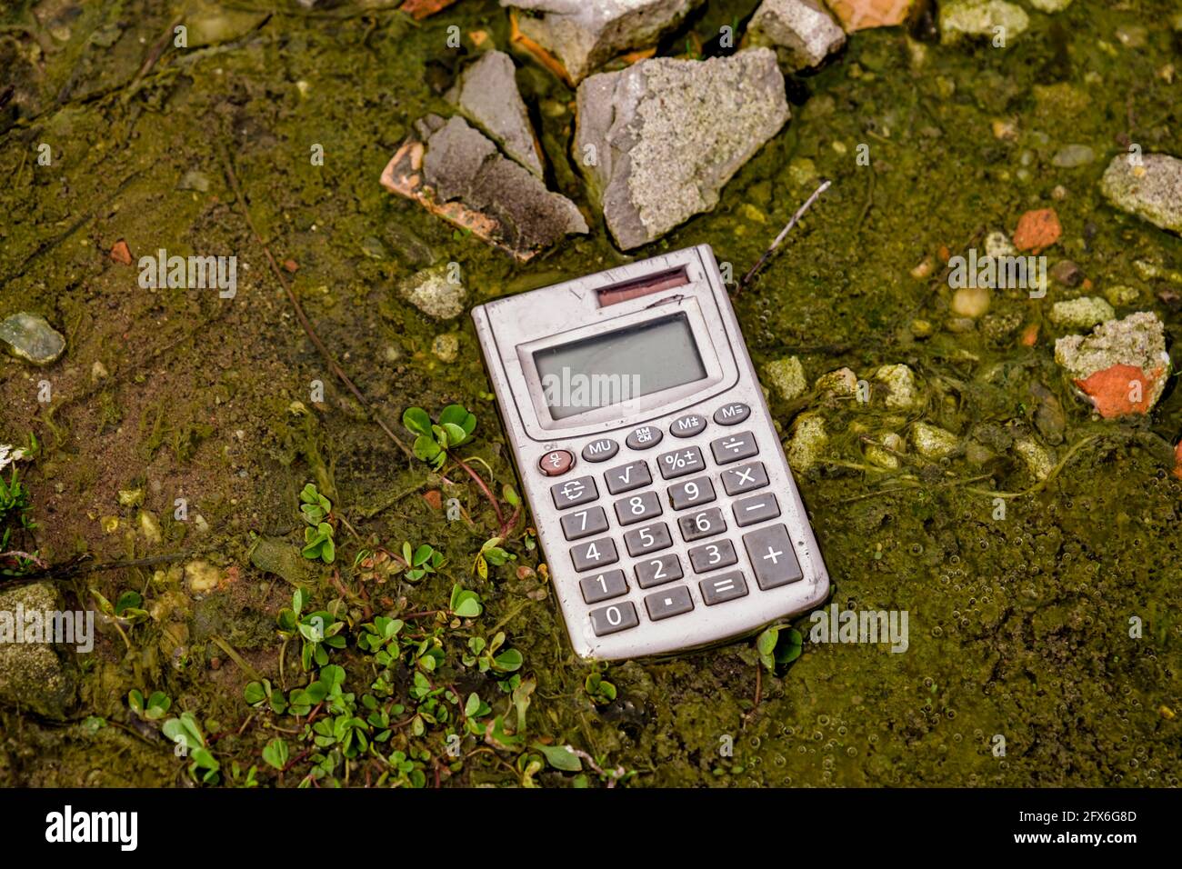 old pocket computer thrown in the water Stock Photo - Alamy