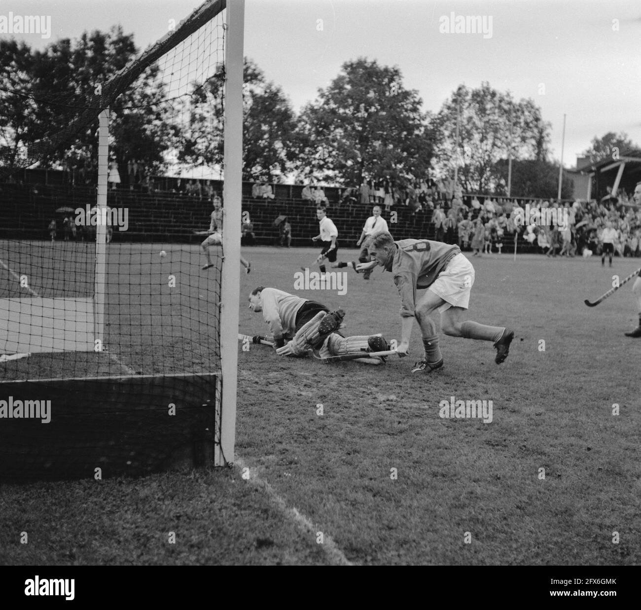 Hockey Amsterdam v Olympics. Goalkeeper Mulder (Amsterdam and right Van ...