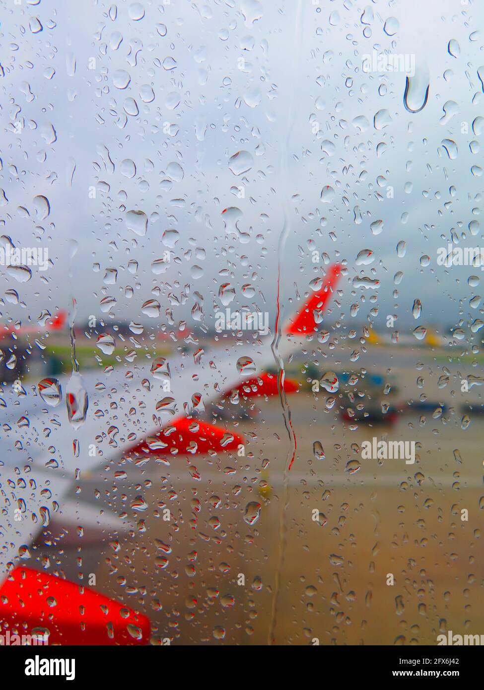 water drops on the airplane window glass, selective focus. selective ...