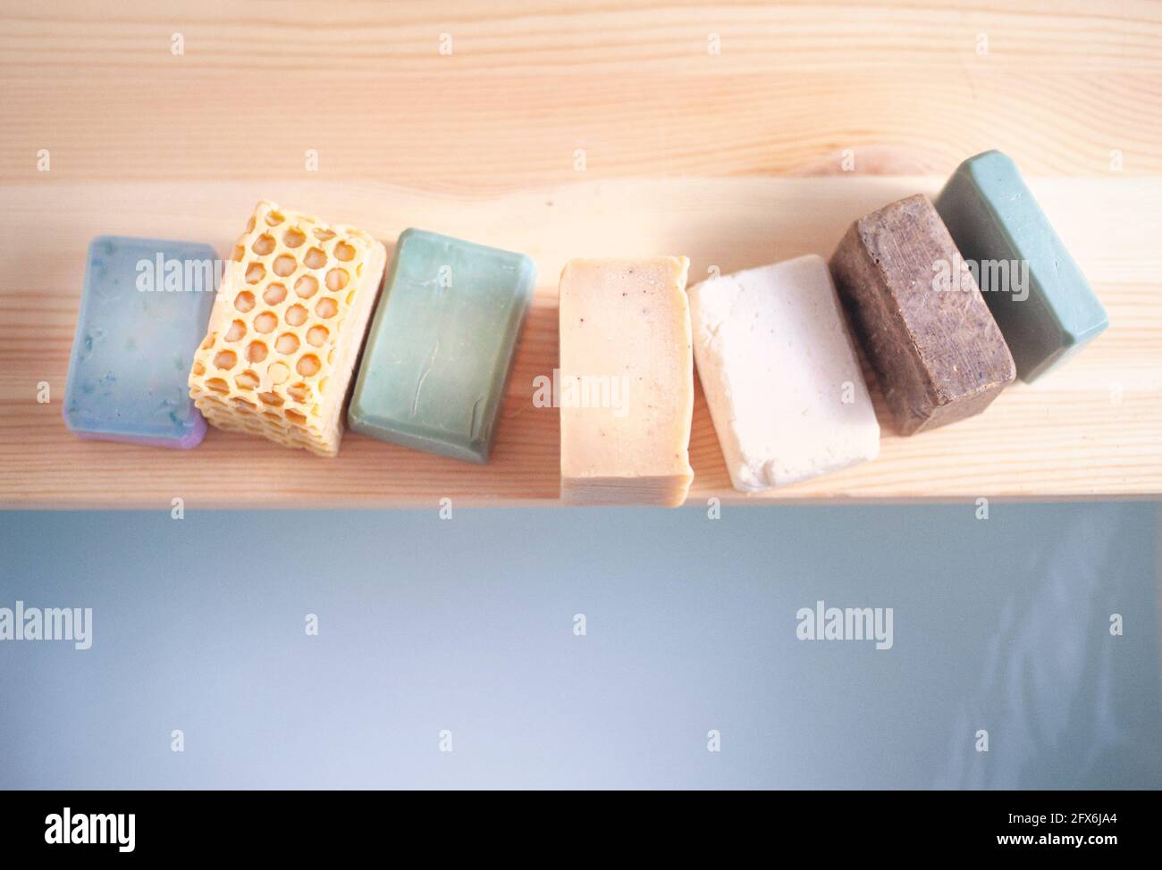 Handmade beautiful bars of organic soap displayed beside a luxurious ...