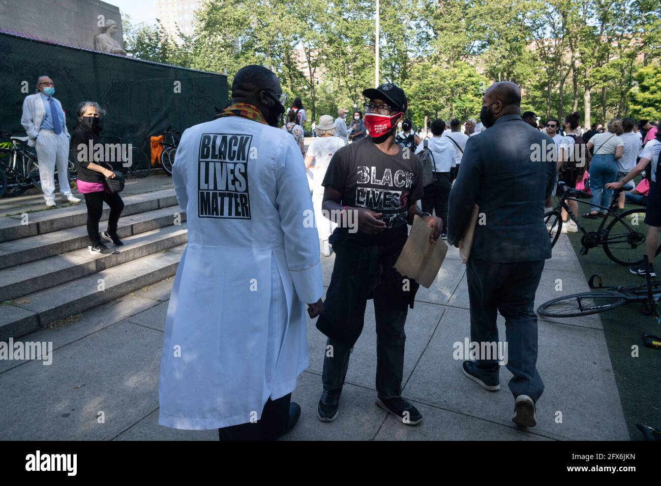 May 25, 2021: Rev. KEVIN MCCALL, left, greets a demonstrator at the ...