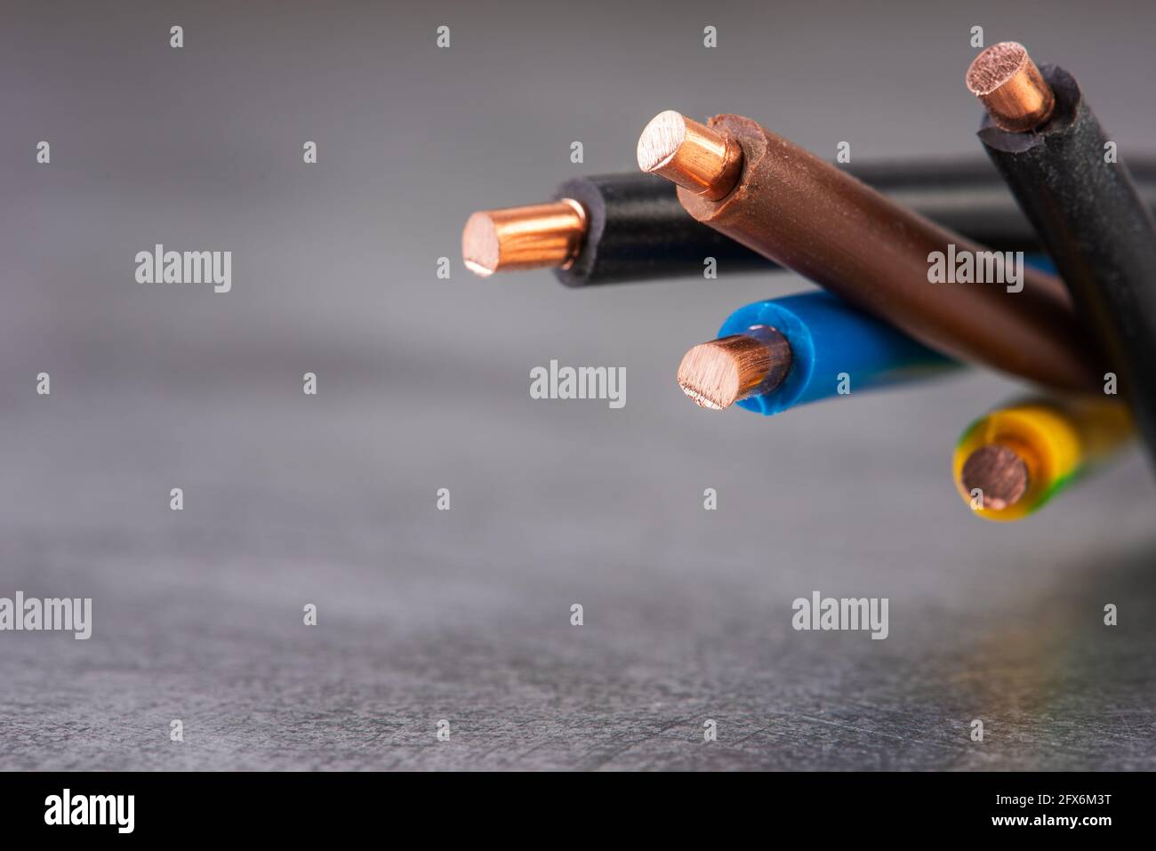 Electrical copper cable wire close-up isolated on shiny metal ...